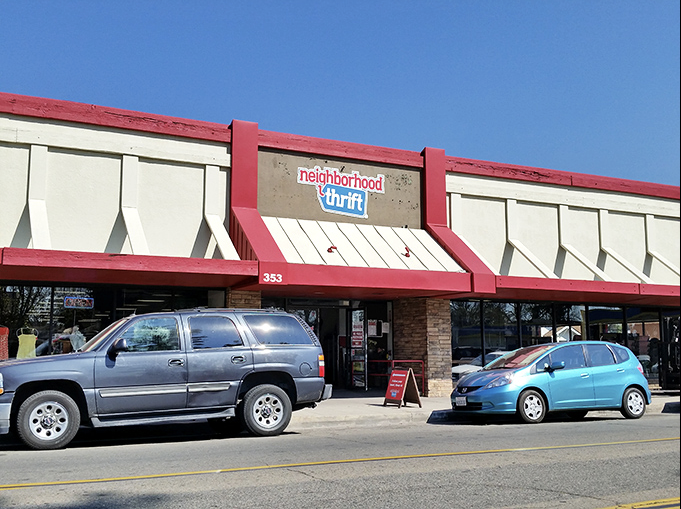 That cheerful red trim and friendly storefront make this look like the neighborhood thrift store everyone wishes they had nearby.