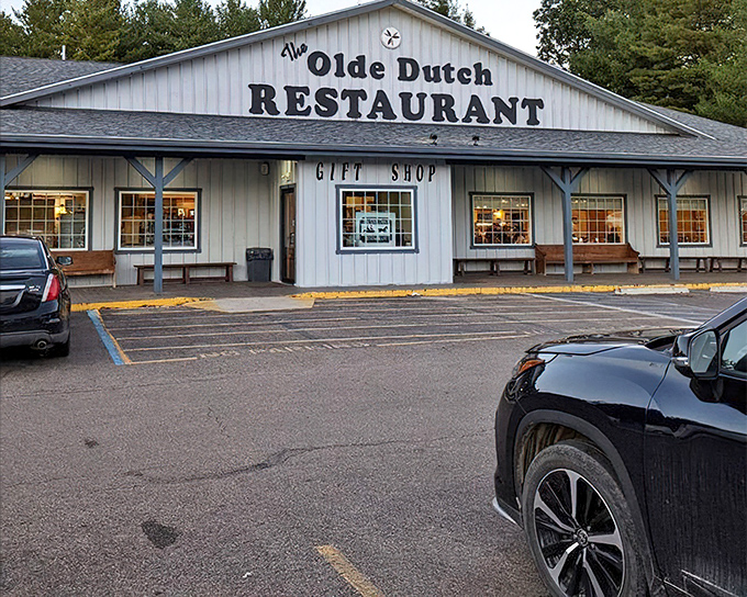 The Olde Dutch Restaurant's rustic barn-style exterior promises authentic flavors. Where wood siding signals wood-fired goodness inside.
