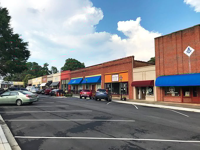 Pendleton's town square showcases classic brick buildings surrounding a lush green space.