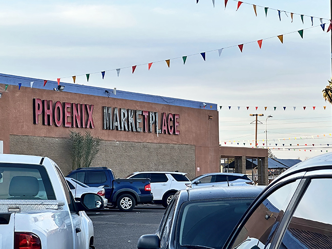 Phoenix Marketplace announces itself with festive flags, a landmark for those who worship at the altar of good deals.
