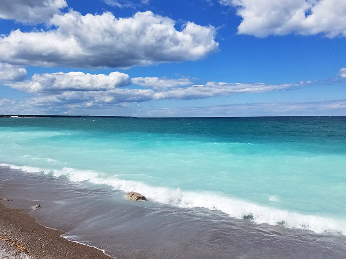 Rogers City's shoreline stretches toward the horizon. That beach is calling your name on this perfect summer day!