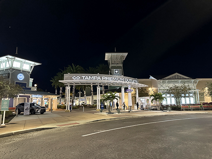 Tampa Premium Outlets' nighttime entrance glows with possibility &ndash; proof that bargain hunting doesn't stop when the sun goes down.