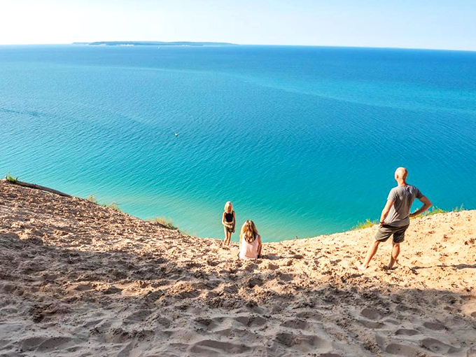 Traverse City: Nature's infinity pool where sky meets water in fifty shades of blue. That bench is the best seat in Michigan.