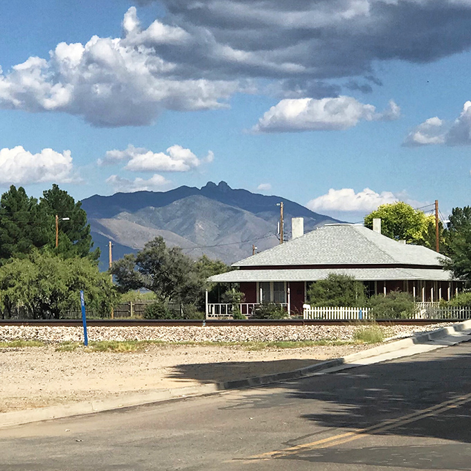 Willcox's historic train depot stands as a reminder of the town's railroad heritage against a backdrop of distant mountains.