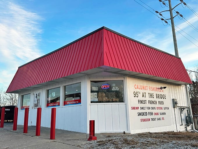 Calumet Fisheries' bright red roof stands out against the sky—a landmark for those seeking smoked seafood perfection.