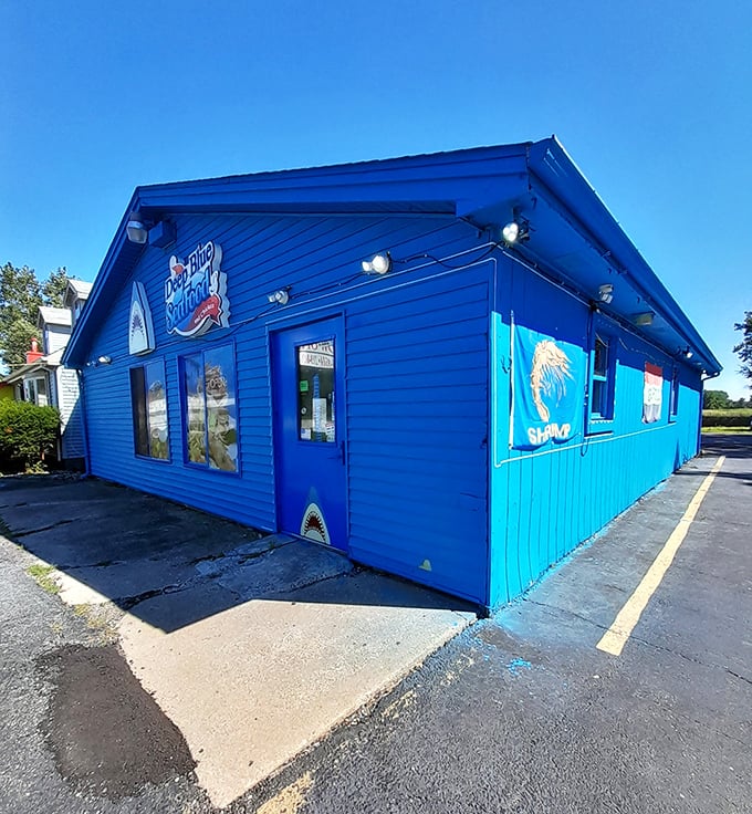 Corner view of Deep Blue Seafood shows off its unmissable azure siding. It's like the building itself is saying "Yes, we know our seafood!"