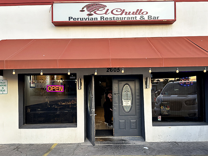 El Chullo's unassuming storefront hides culinary treasures from Peru. That "OPEN" sign is your invitation to a seafood adventure.