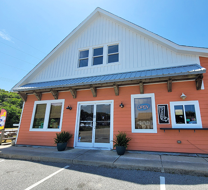 That orange exterior glows like a sunset, promising sandwiches worthy of your Outer Banks adventure.