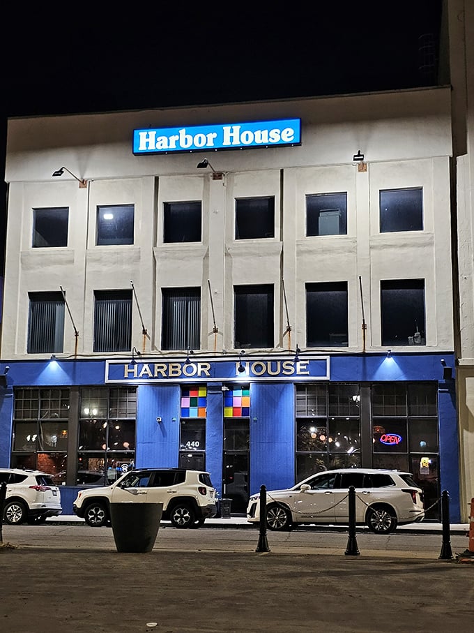 Night transforms Harbor House into a glowing blue beacon for seafood lovers. Detroit's waterfront spirit lives in every dish here.