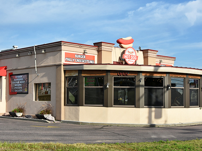 Hot Dog Avenue's distinctive building stands ready to serve hungry Dells visitors. That hot dog on top isn't just decoration—it's a promise.