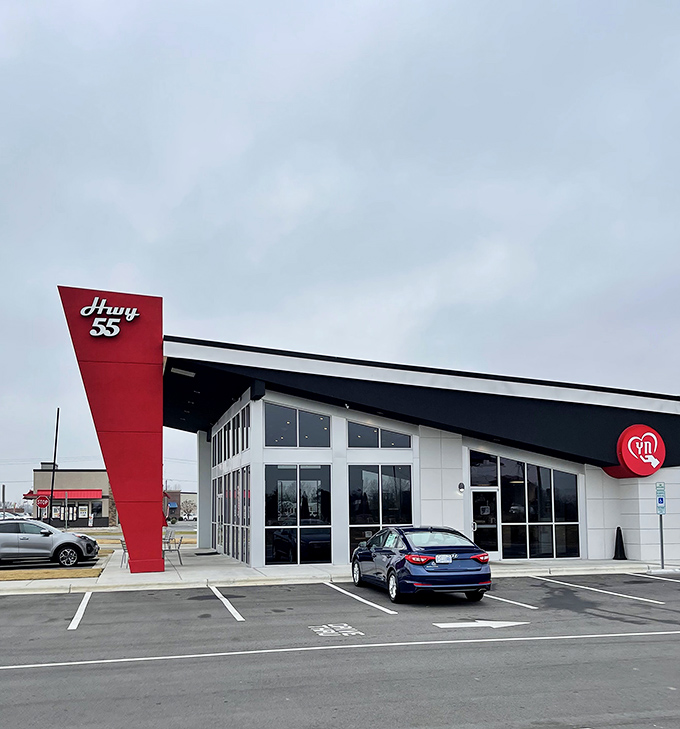 The distinctive red and white architecture of Hwy 55 stands out like a time machine to the golden age of burger joints.