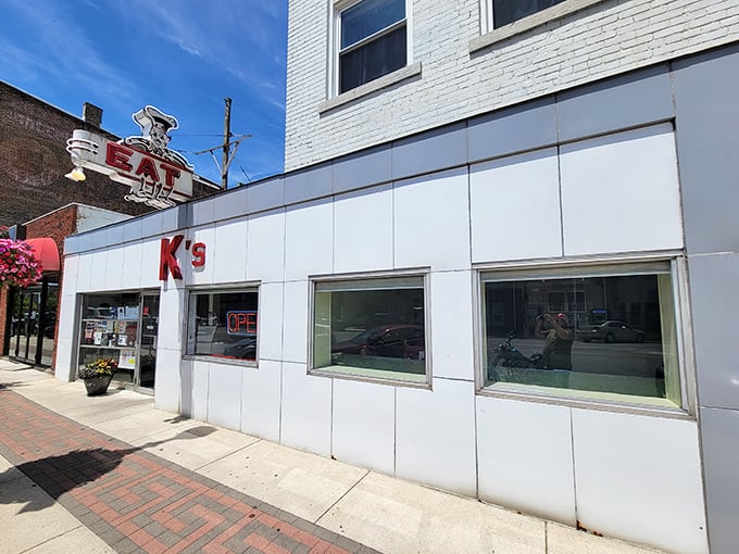 K's white storefront is like the plain cover of a thrilling book. Inside this unassuming exterior lies a burger story worth savoring.