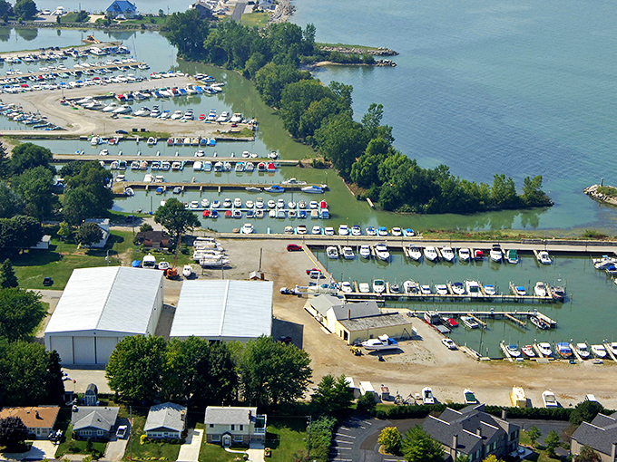 Sandy beach meets grassy shore in a perfect blend that makes barefoot walks mandatory, not optional.