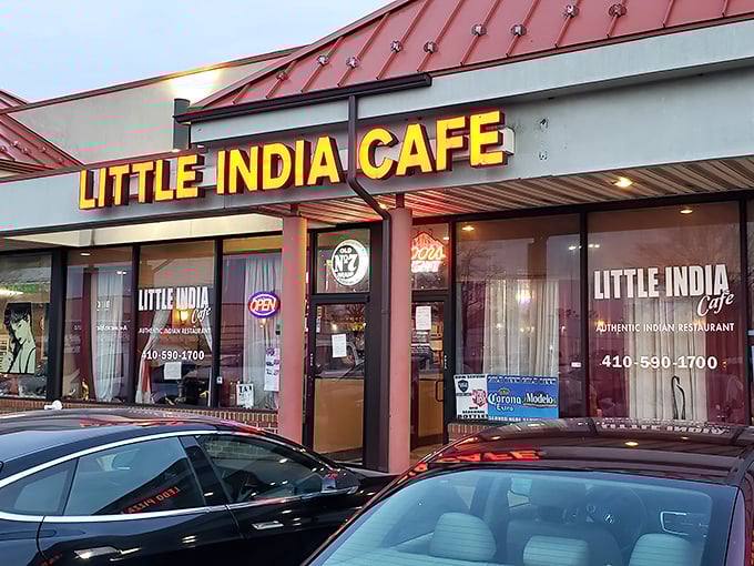 The evening lights make Little India Caf&eacute; glow like a jewel box of flavors. Those illuminated windows offer a glimpse into a world where butter chicken dreams come true.