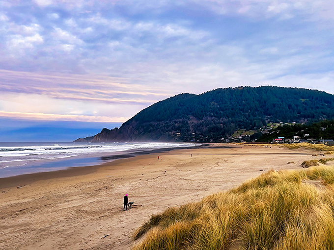 Neahkahnie Mountain stands guard over Manzanita's golden shores like a gentle giant watching over a sandy playground.