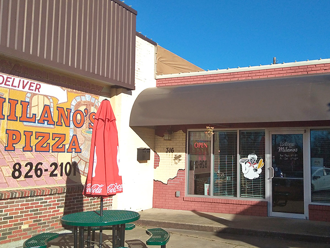 The Coca-Cola umbrella says it all &ndash; classic, refreshing, and universally loved. Milano's brings pizza perfection to the heart of small-town Texas.