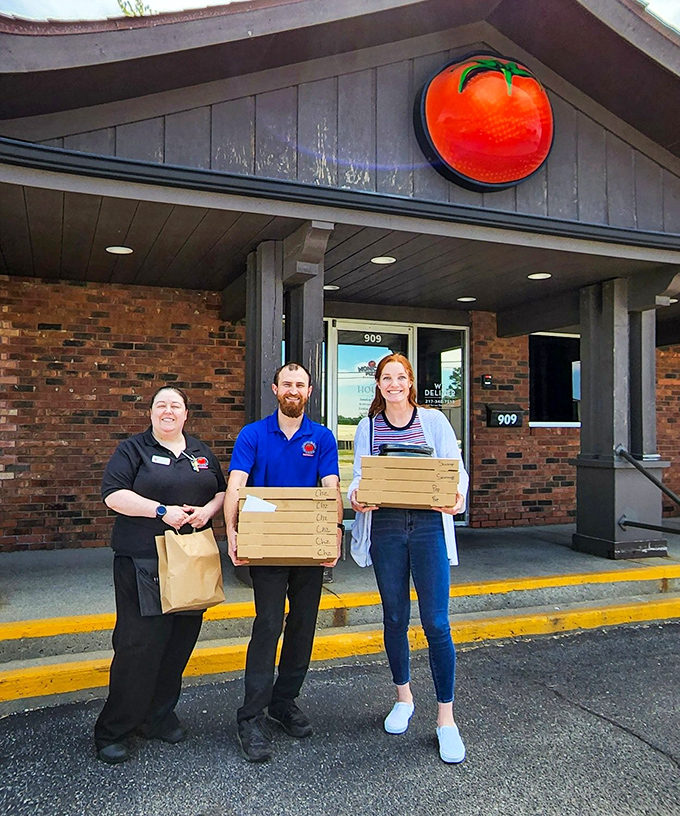 That bright tomato sign is like a lighthouse beacon, guiding hungry souls to thin-crust paradise in Charleston.