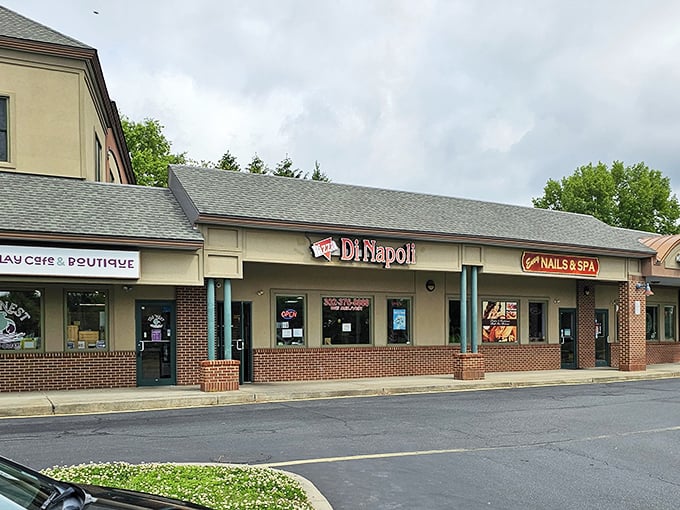 Nestled between neighboring shops, Pizza Di Napoli waits to be discovered. Sometimes the best pizza hides in plain sight.