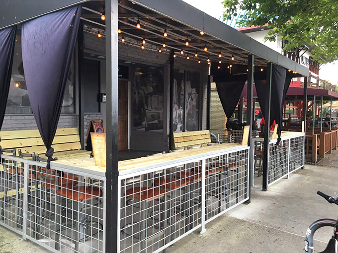 Repeal's outdoor seating area with string lights creates the perfect burger ambiance. Where evening breezes complement every bite.