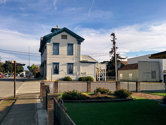 The white-washed buildings of Mission San Juan Bautista stand as elegant sentinels guarding California's Spanish heritage.