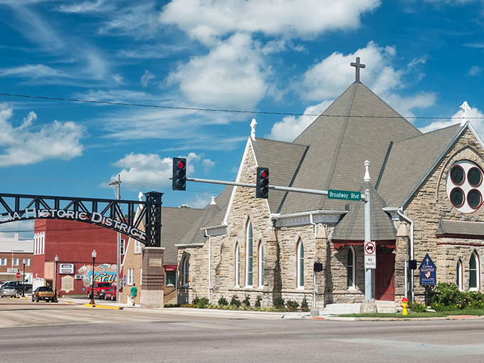 Gothic stone beauty meets prairie sky: Calvary Episcopal's spires reach heavenward with architectural grace.
