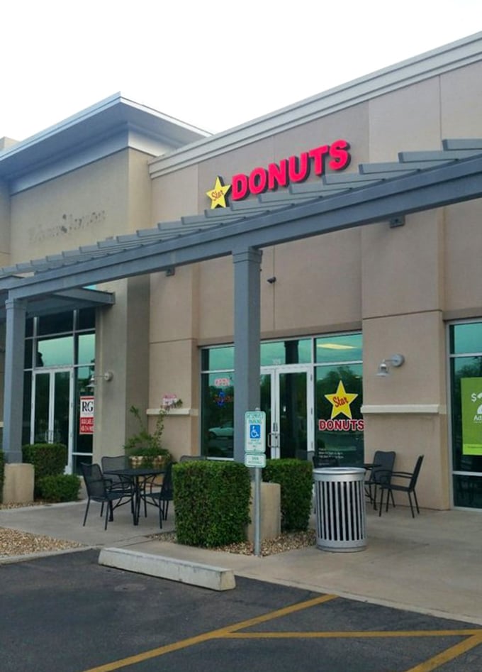 The understated elegance of Star Donuts' storefront belies the flavor explosions waiting inside. Those outdoor tables are prime donut-enjoying real estate.
