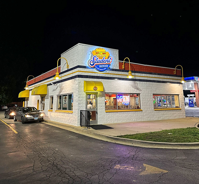 Halal burger perfection glows under the night sky, proving delicious food brings everyone together.