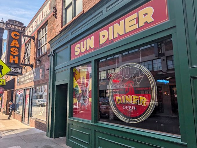The golden Sun Diner sign glows against the historic brick, beckoning music lovers and breakfast enthusiasts alike.