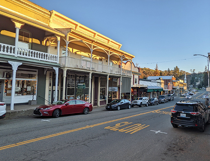 The golden glow of sunset bathes Sutter Creek's main street, highlighting architecture that's survived since the Gold Rush.