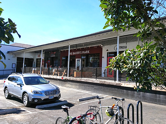 Clean lines and warm lighting invite you into The Baker's Mark, where sandwich craftsmanship meets architectural precision.