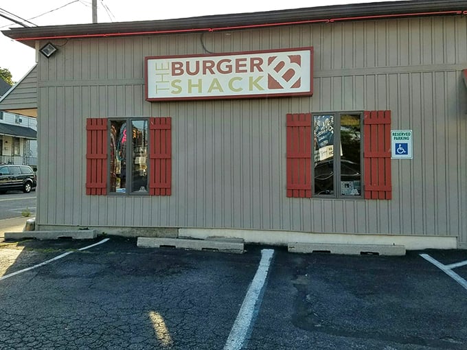 Simple gray siding and red accents &ndash; The Burger Shack knows flashy exteriors are unnecessary when your burgers speak volumes.