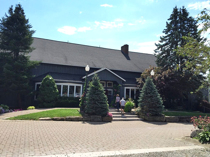 The dark exterior and perfect landscaping hint at the attention to detail you'll find on every plate inside.