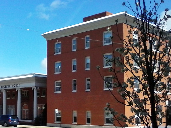 The Buckeye House stands as a cornerstone of Uhrichsville&mdash;solid brick and steady presence, much like the town's resilient character.