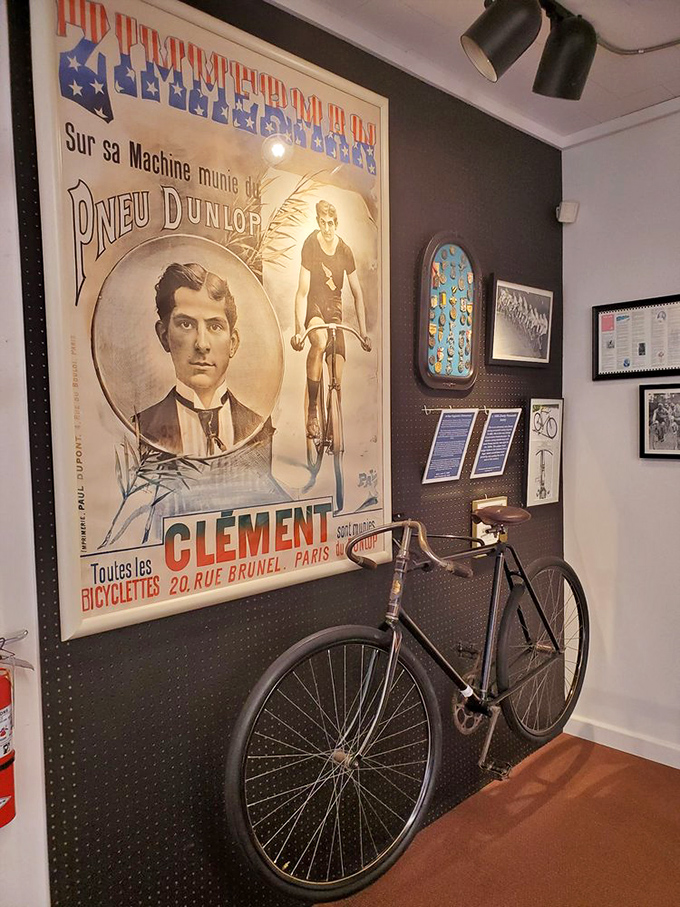 This vintage French cycling poster pairs perfectly with the antique bicycle below it&mdash;both capturing the elegant simplicity of early cycling culture.