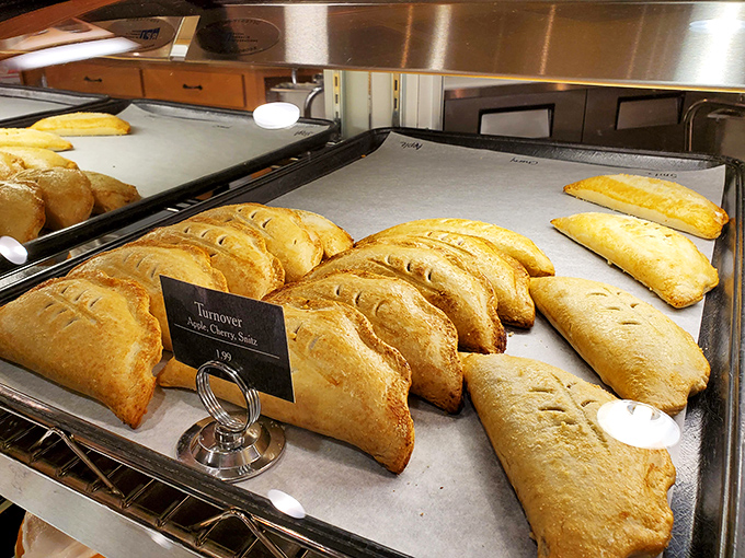 These hand-held turnovers aren't just pastries&mdash;they're portable joy, golden-brown treasures lined up like soldiers ready for delicious duty.