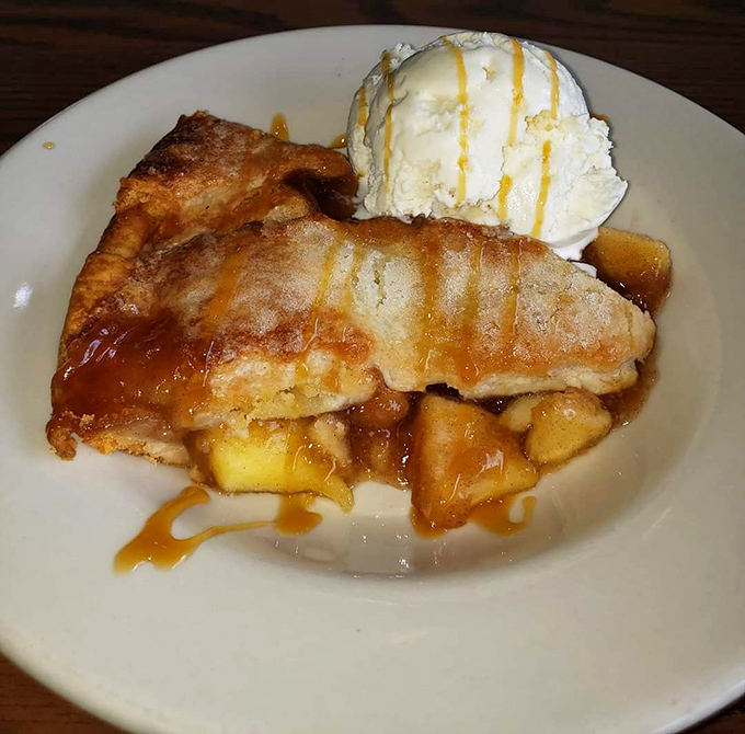 Apple pie that doesn't need Instagram filters to look good, topped with ice cream melting into those warm cinnamon-spiced crevices. This is why forks were invented.
