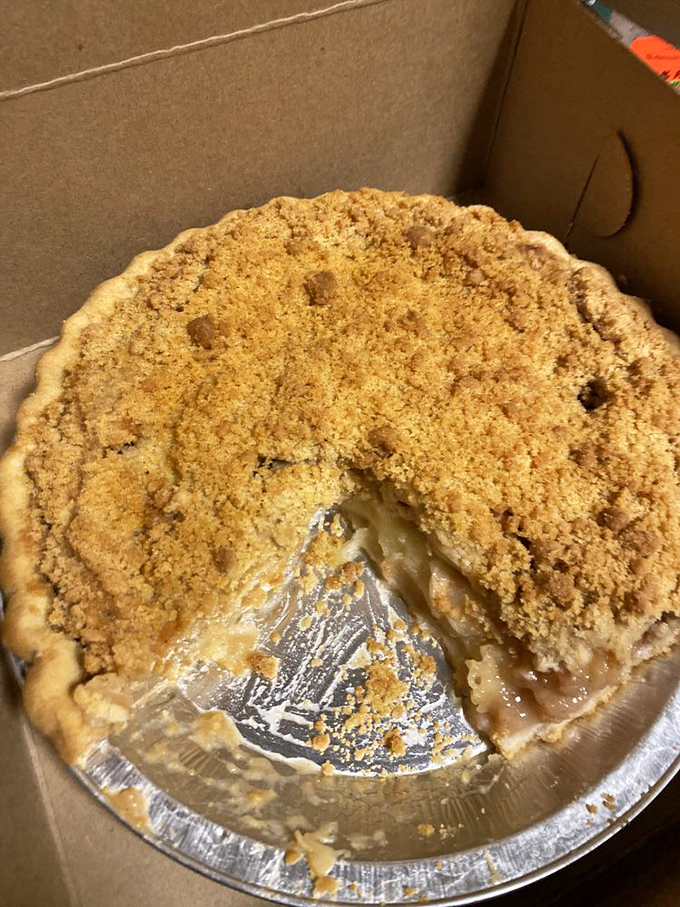 Apple pie that looks like it jumped straight out of a Norman Rockwell painting &ndash; complete with that "someone took a slice already" authenticity.