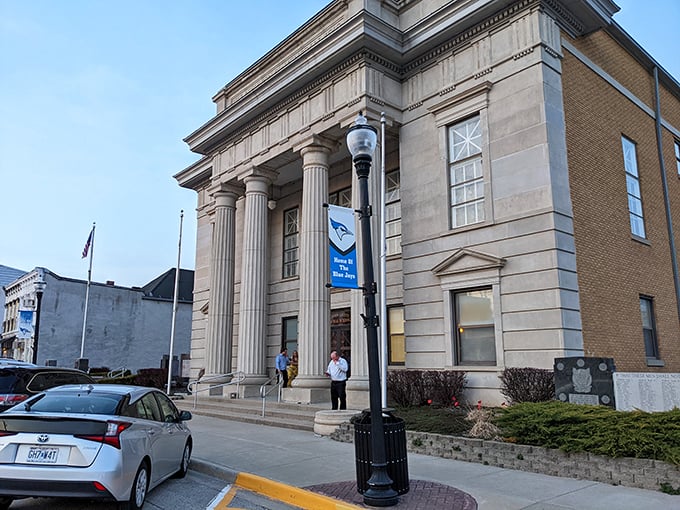 Classical columns frame this impressive civic building, where history and government converge under a bright Midwestern sky.