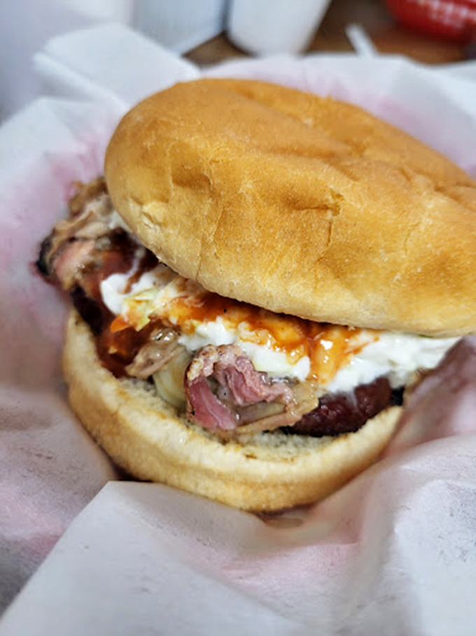 This isn't just a sandwich; it's a structural marvel of smoke-kissed brisket that somehow maintains perfect integrity despite its juiciness.