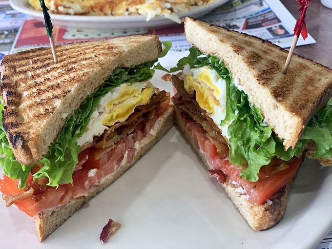 The BLT&mdash;where bacon, lettuce and tomato achieve perfect harmony. The diagonal cut isn't just pretty&mdash;it's sandwich engineering at its finest.