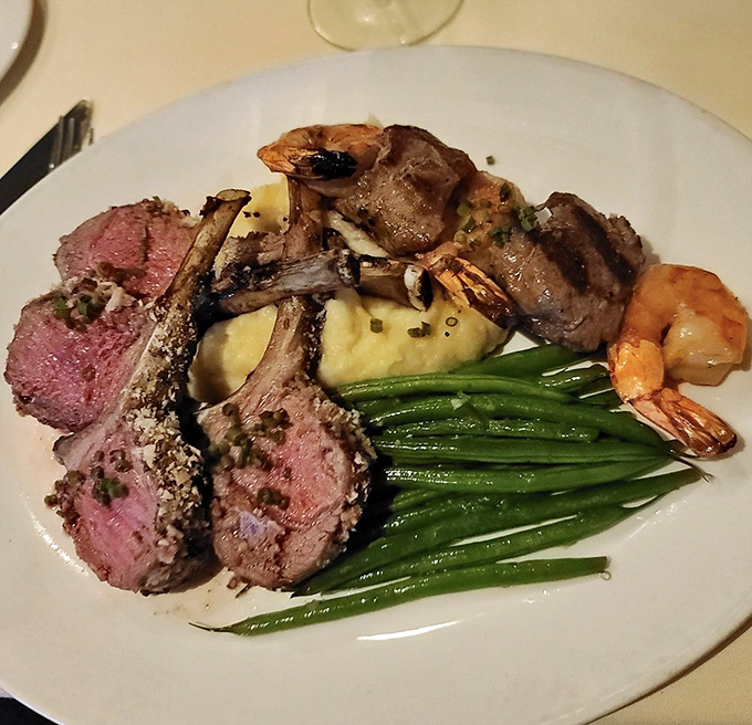 A plate that speaks three languages: lamb chops whispering "elegance," green beans saying "freshness," and that potato declaring "comfort."
