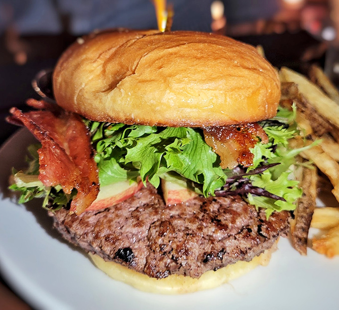 When bacon and fresh greens join forces with a perfectly cooked burger, resistance becomes entirely futile.