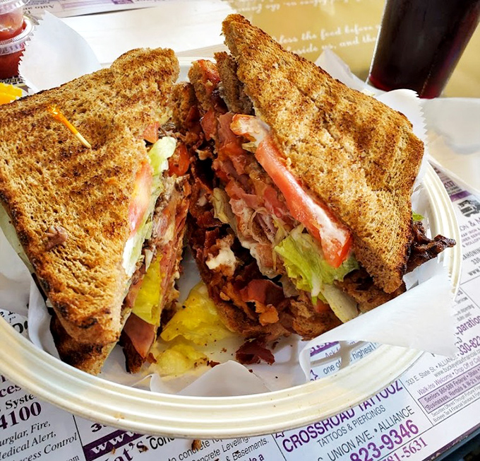 This isn't just a club sandwich&mdash;it's architectural perfection between toasted bread, where each layer tells its own delicious story.