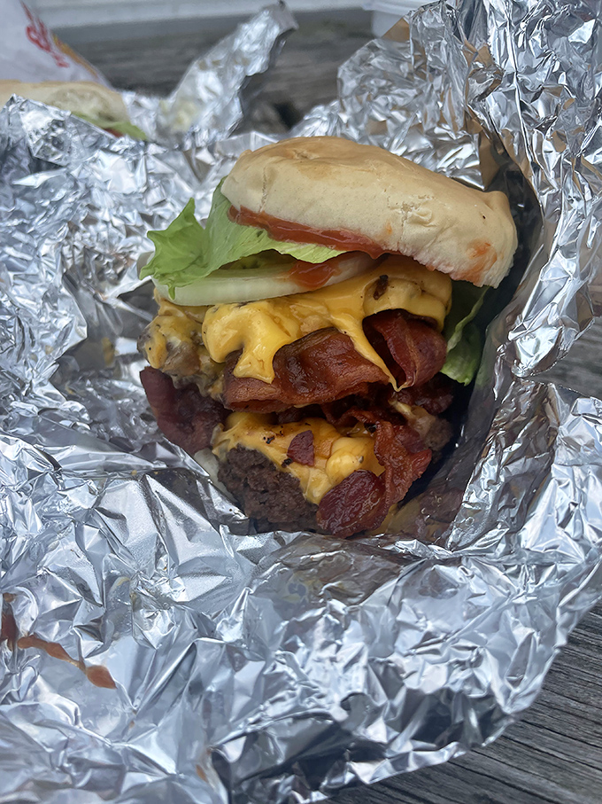 When bacon enters the burger equation, all other math becomes irrelevant. This foil-wrapped treasure is worth every napkin you'll need.