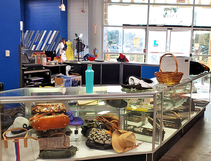 Behind glass cases, vintage handbags and jewelry wait for their second act. That Coach purse has stories to tell and new adventures to experience.