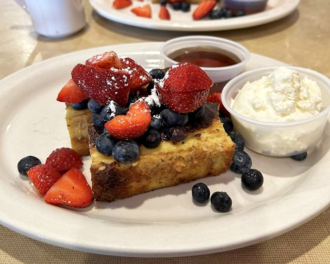 French toast that's dressed for success, topped with berries that didn't just fall on the plate &ndash; they made a grand entrance. 