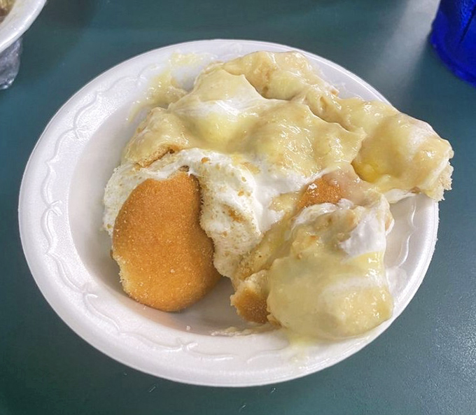 Banana pudding that would make Willy Wonka weep with joy. Creamy, dreamy comfort in a bowl with those nostalgic vanilla wafers softened to perfection.