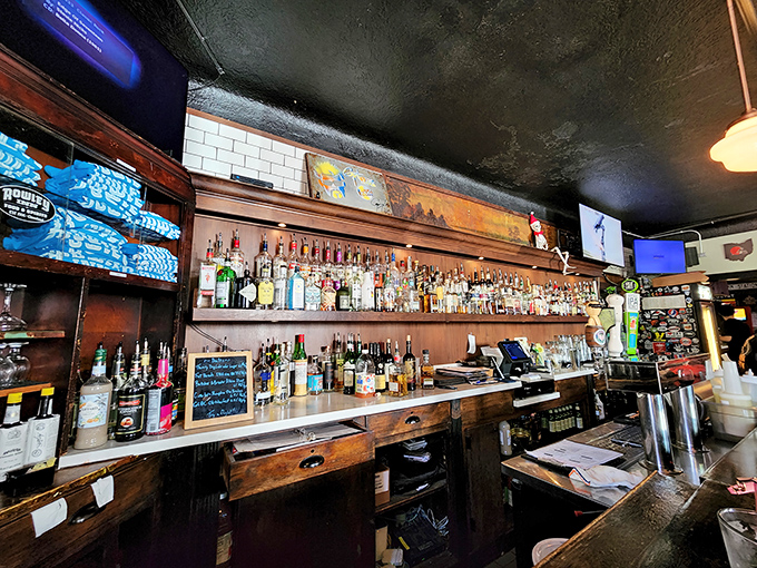 A bar stocked with enough spirits to lift yours. The wooden backdrop speaks of history, while the selection speaks of good taste.