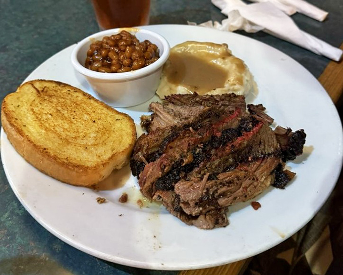 Brisket that's been smoking longer than some relationships last, served with sides that know their supporting role but still manage to steal scenes.