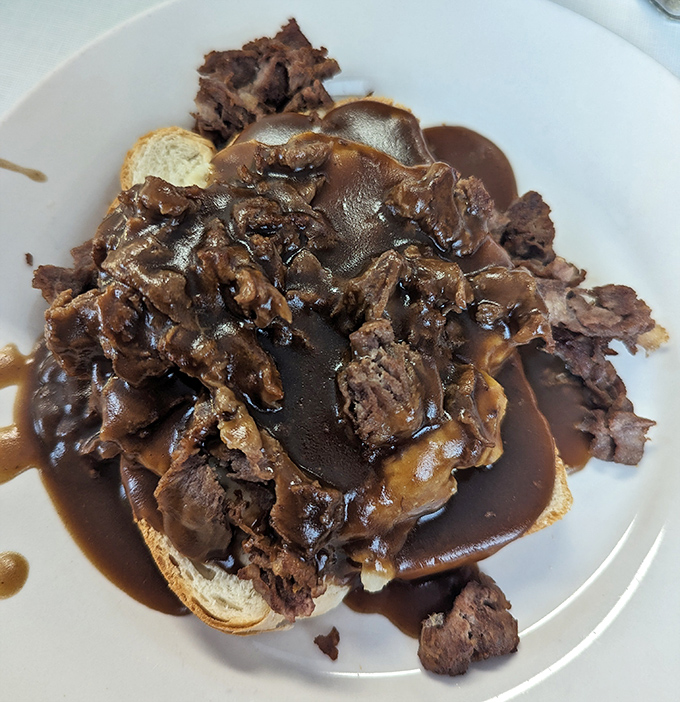 The Beef Manhattan&mdash;where meat, gravy, and bread unite in holy matrimony. A dish that proves sometimes the most beautiful things in life are the messiest.